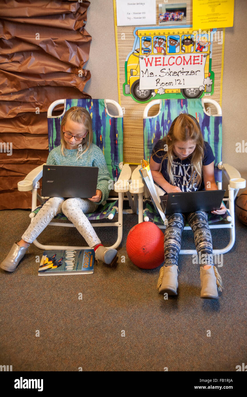 Girl sitting in a chair in front of a computer hi-res stock photography ...