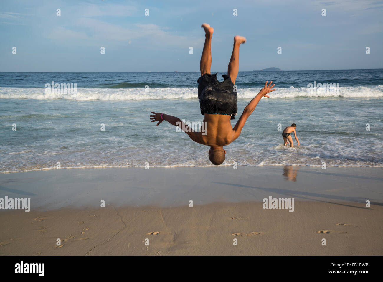 Copacabana beach, Boy jumping in the air, Rio de Janeiro, Brazil Stock ...