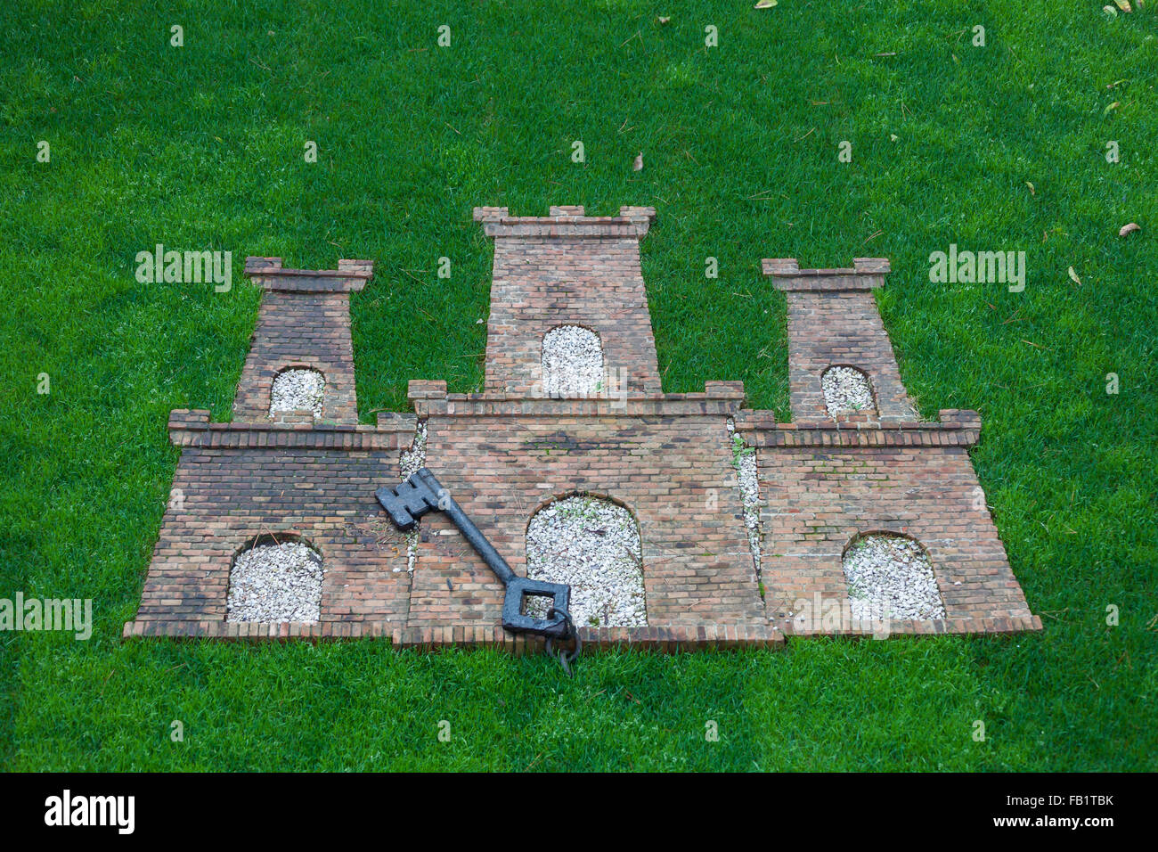 Castle and Key decorative sculpture in the ground Stock Photo - Alamy