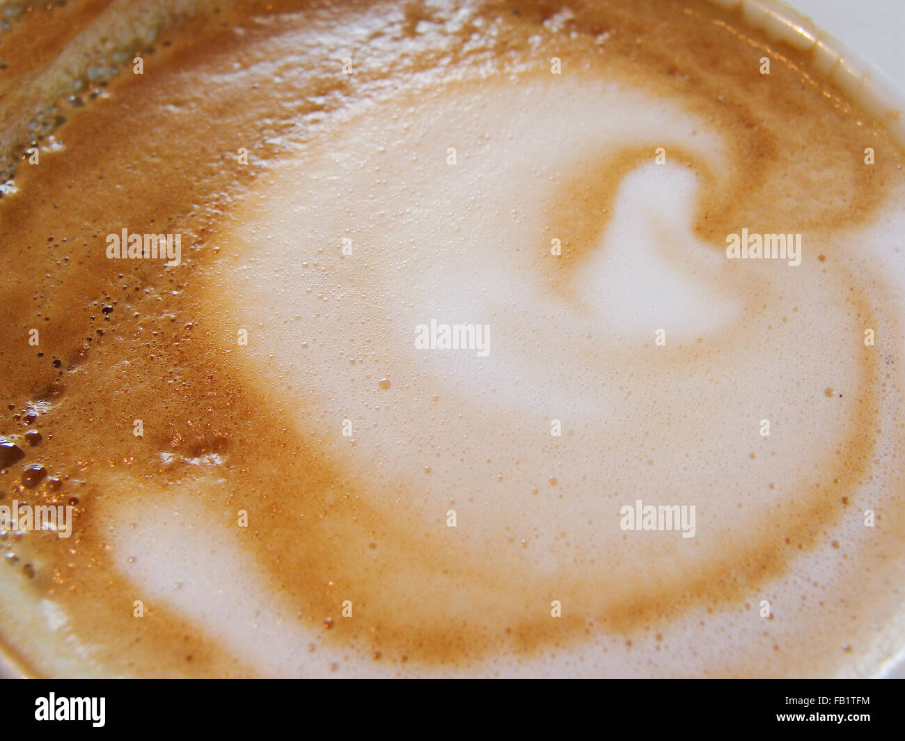 White Cup with a gourmet coffee and foam figure Stock Photo - Alamy
