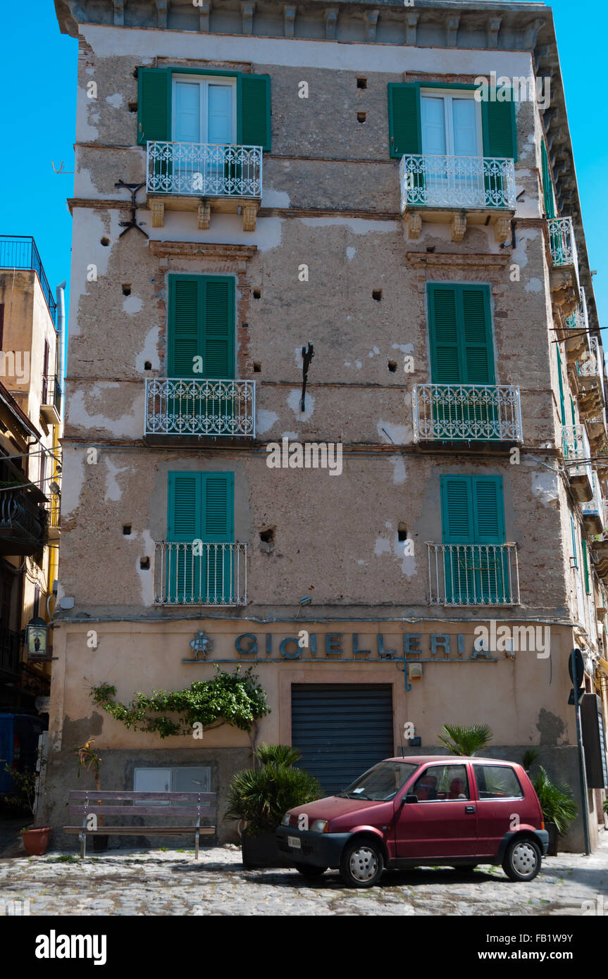 Italian stone house fron with green shutter blinds and smal red car in ...