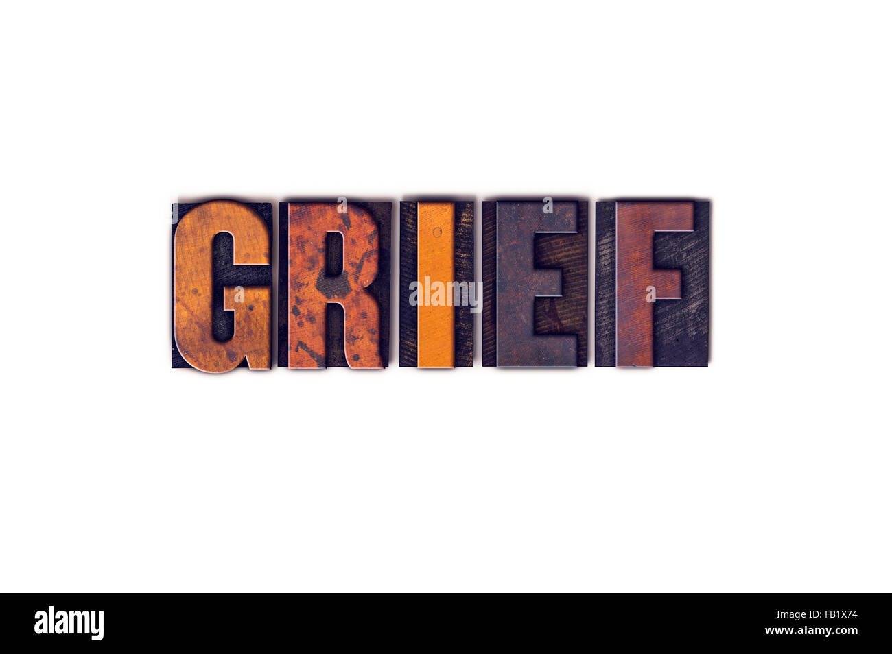 The word "Grief" written in isolated vintage wooden letterpress type on ...