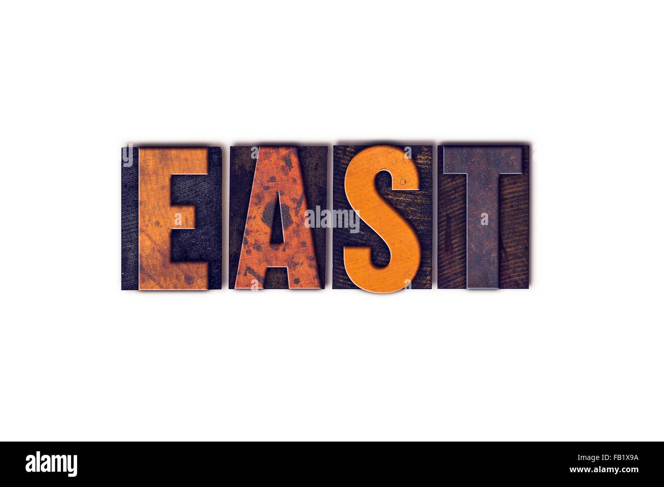The word "East" written in isolated vintage wooden letterpress type on ...