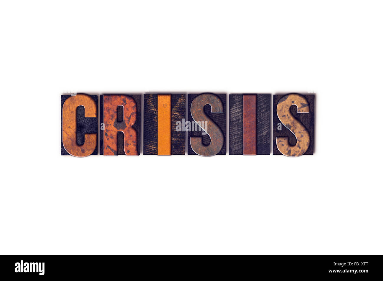 The word "Crisis" written in isolated vintage wooden letterpress type ...