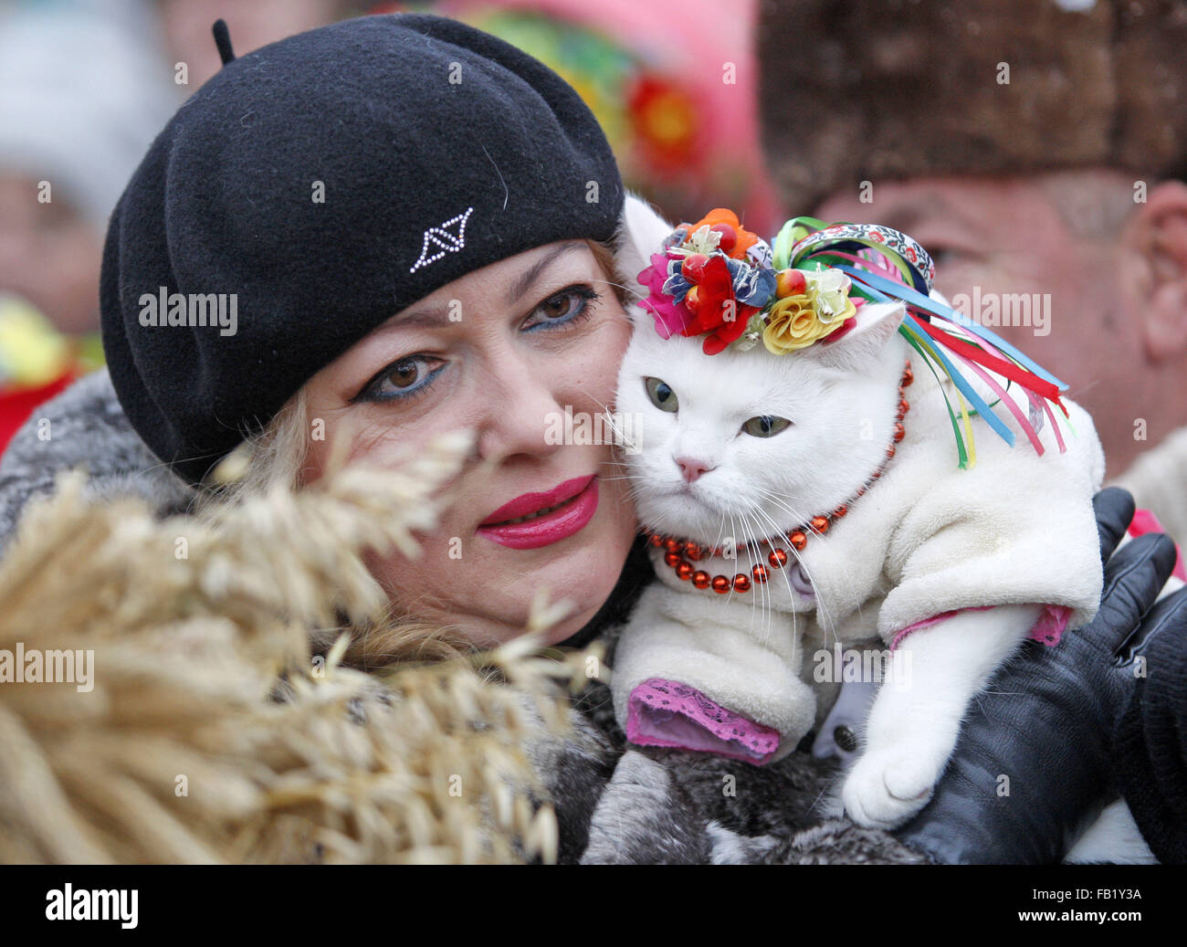 Kiev, Ukraine. 07th Jan, 2016. An Ukrainian woman carry a cat dressed ...