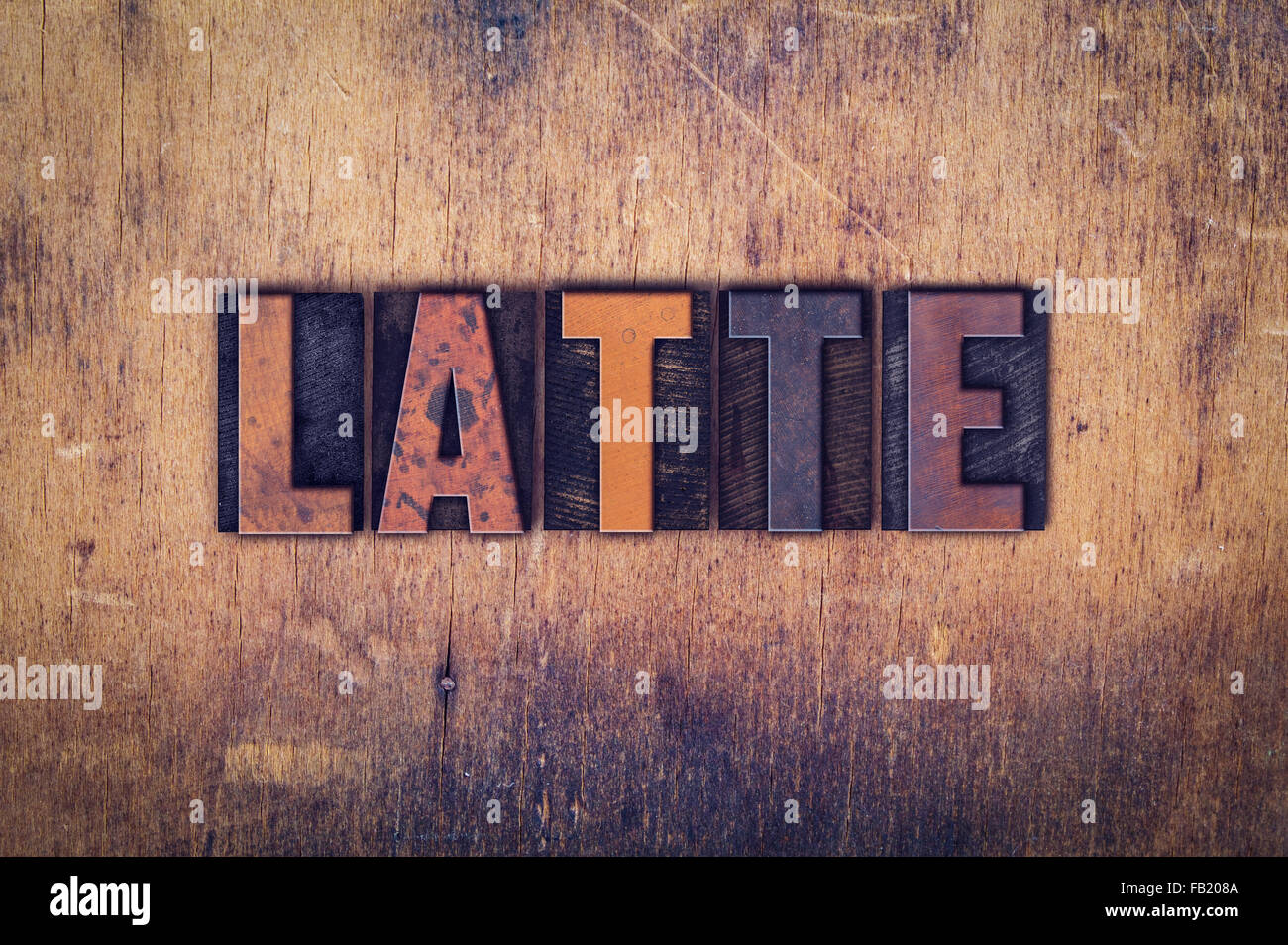 The word "Latte" written in dirty vintage letterpress type on a aged ...