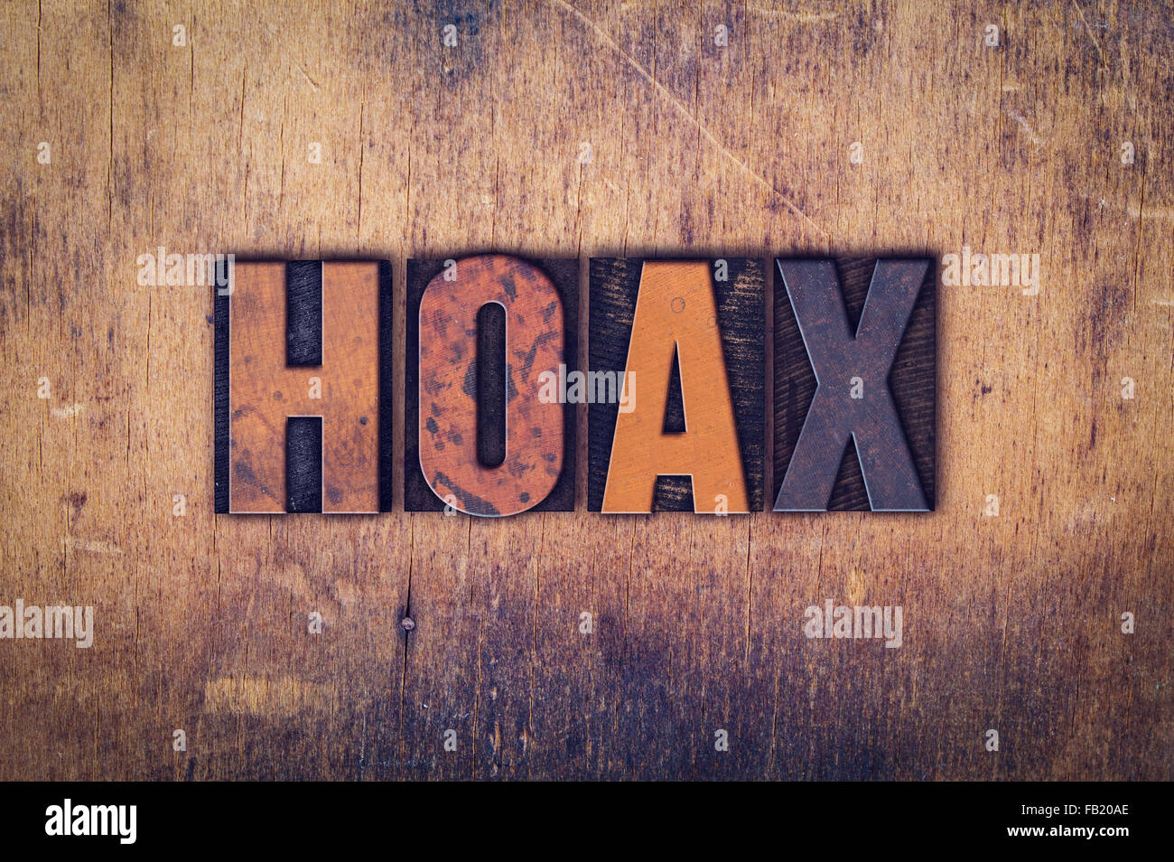 The word "Hoax" written in dirty vintage letterpress type on a aged ...