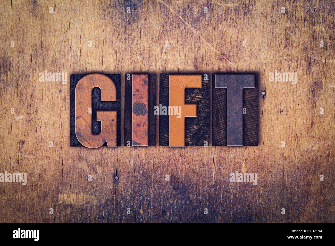 The word "Gift" written in dirty vintage letterpress type on a aged ...