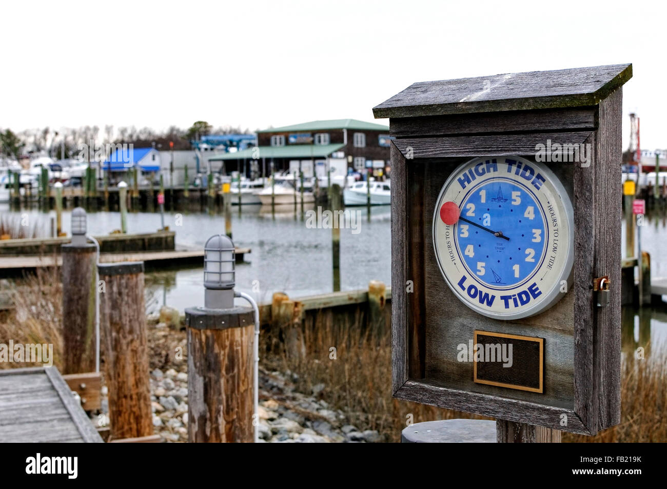 A tide clock provides information to mariners at the Lewes, DE marina ...