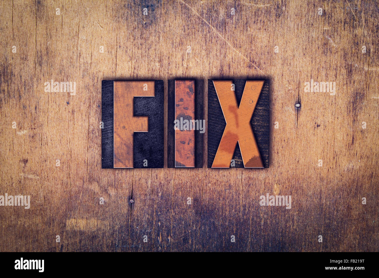 The word "Fix" written in dirty vintage letterpress type on a aged ...