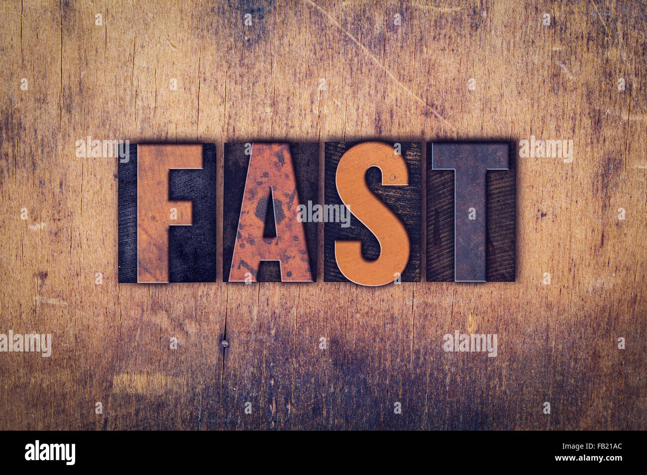 The word "Fast" written in dirty vintage letterpress type on a aged ...
