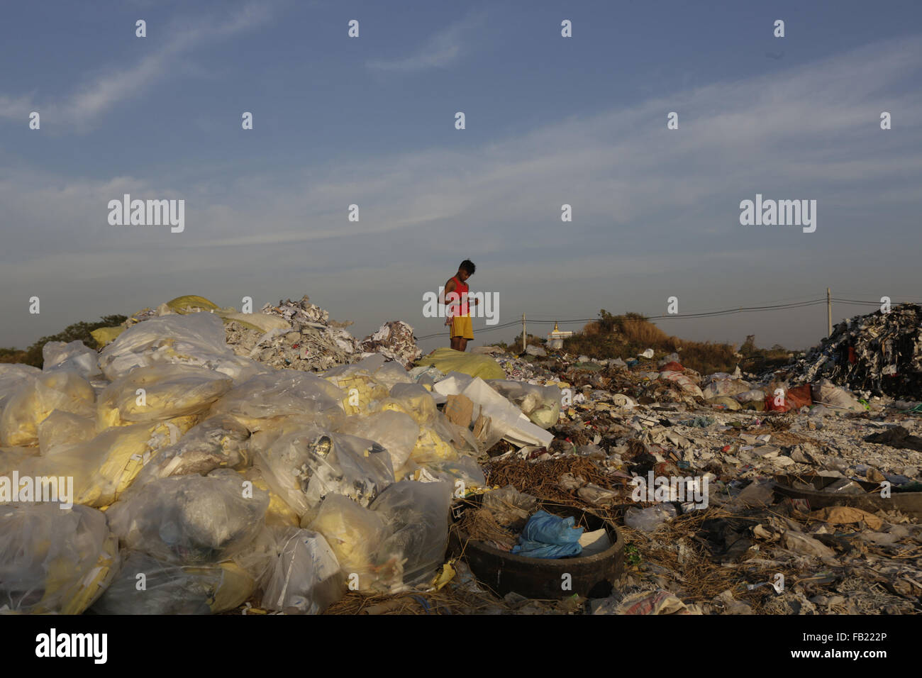 Yangon, Myanmar. 7th Jan, 2016. A boy collects rubbish from dump for ...