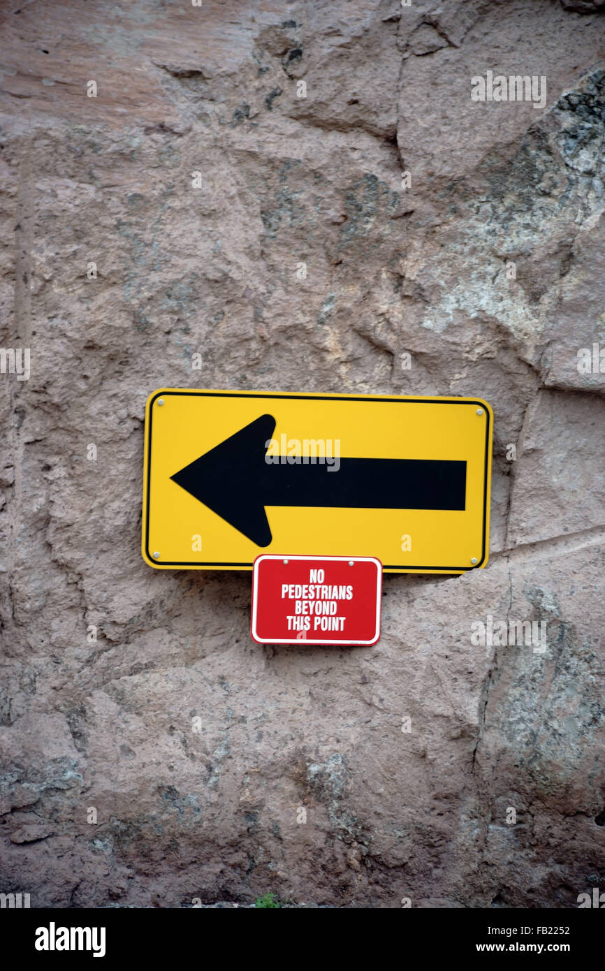 Directional arrow with warning Stock Photo - Alamy