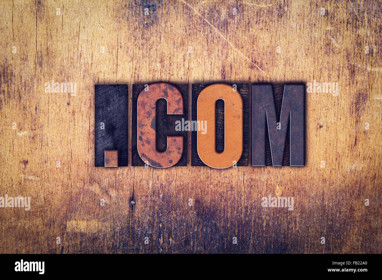 The word "Dot Com" written in dirty vintage letterpress type on a aged ...