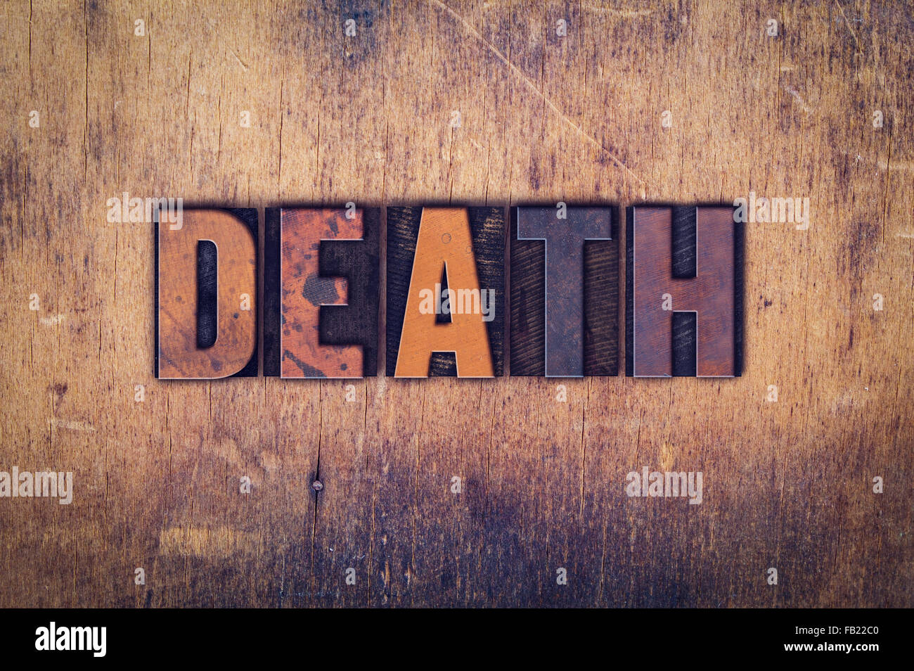 The word "Death" written in dirty vintage letterpress type on a aged ...