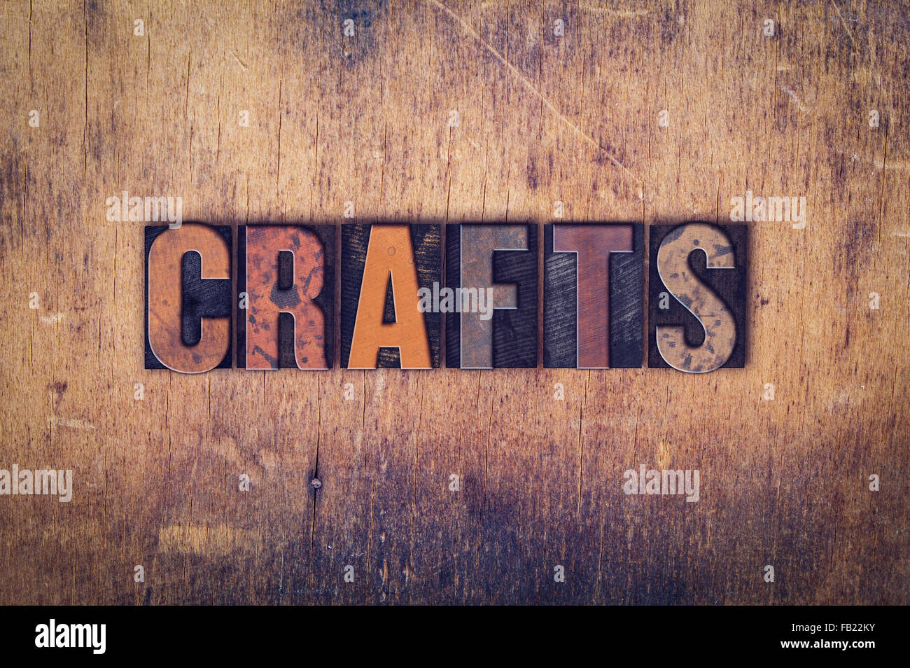 The word "Crafts" written in dirty vintage letterpress type on a aged ...
