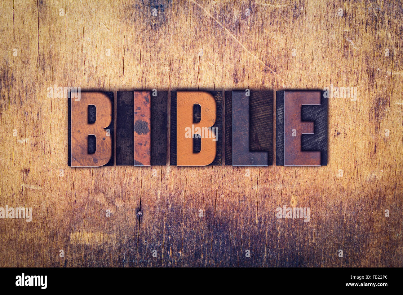 The word "Bible" written in dirty vintage letterpress type on a aged ...