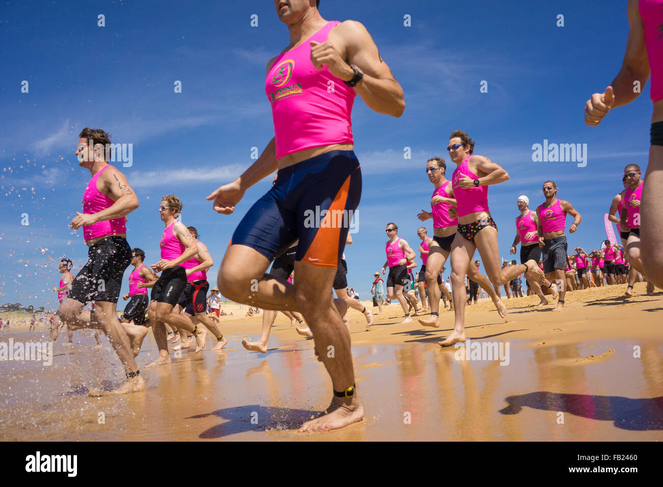Some competitors starting a swiming running race - The Three Points ...