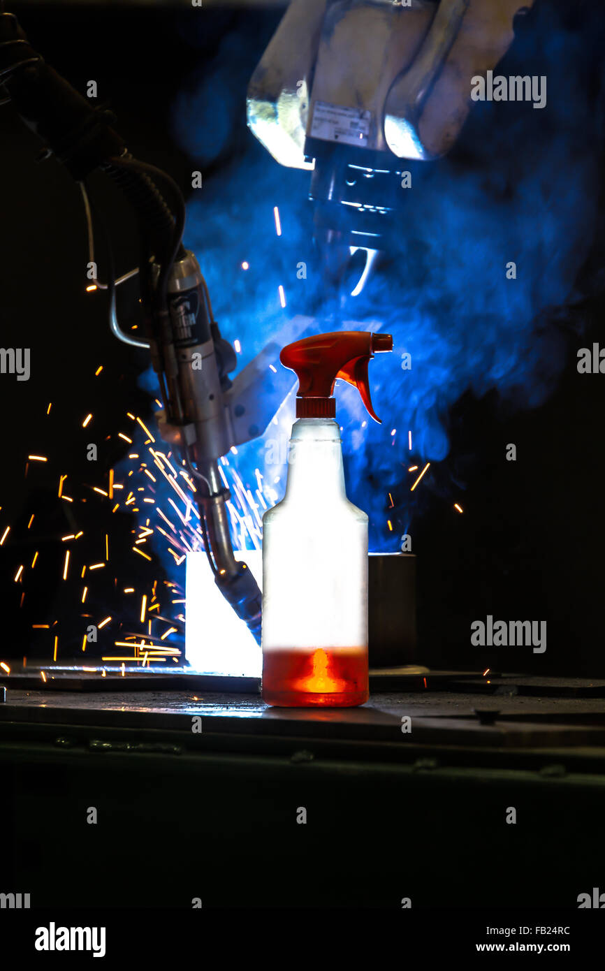Plastic spray bottle with cleaning liquid glowing in front CNC Mig ...