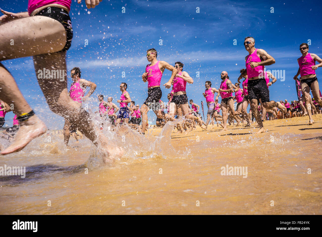 Some competitors starting a swiming running race - The Three Points ...