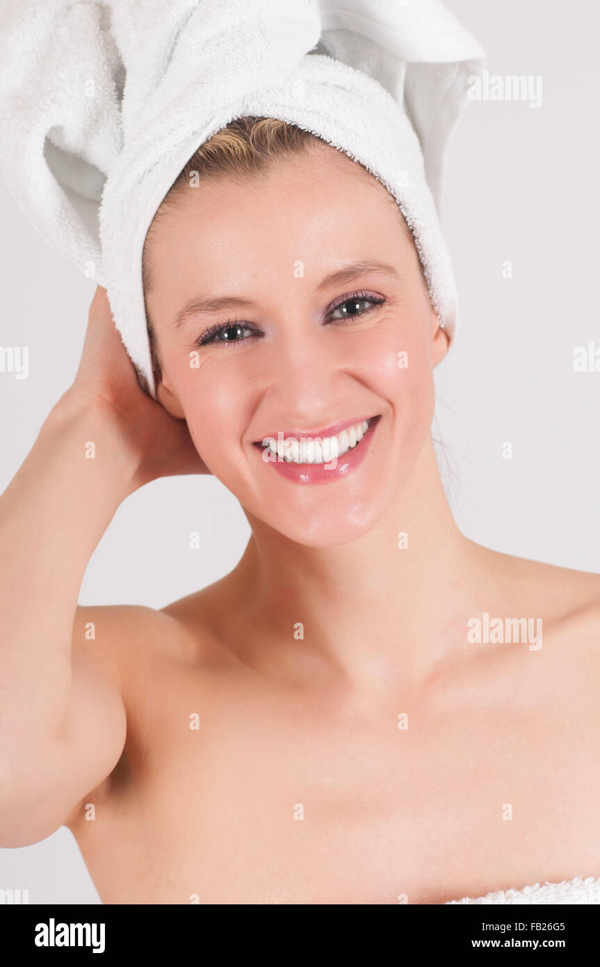 Happy woman after shower with a white towel on her head Stock Photo - Alamy