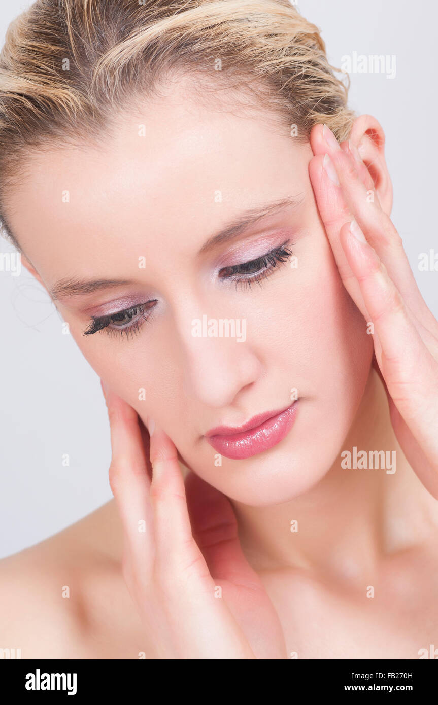 Beautiful young woman hands touching face Stock Photo - Alamy