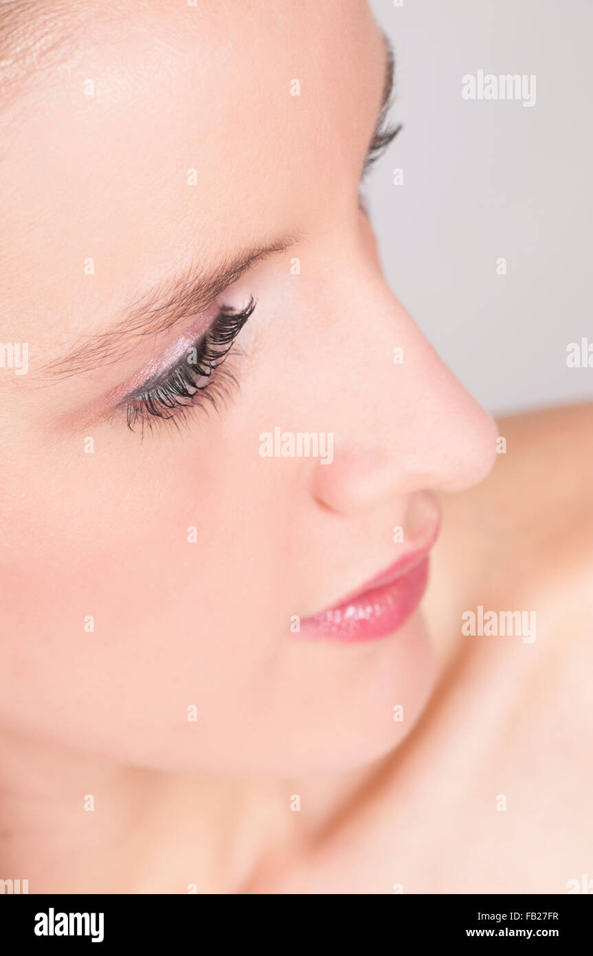 Close up of a beautiful young woman looking away Stock Photo - Alamy