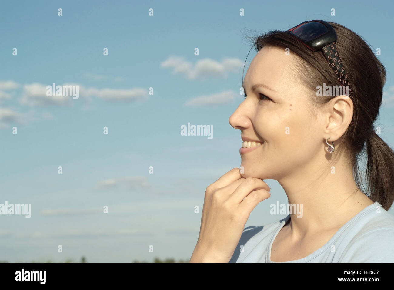 happy nice girl against the sky Stock Photo - Alamy