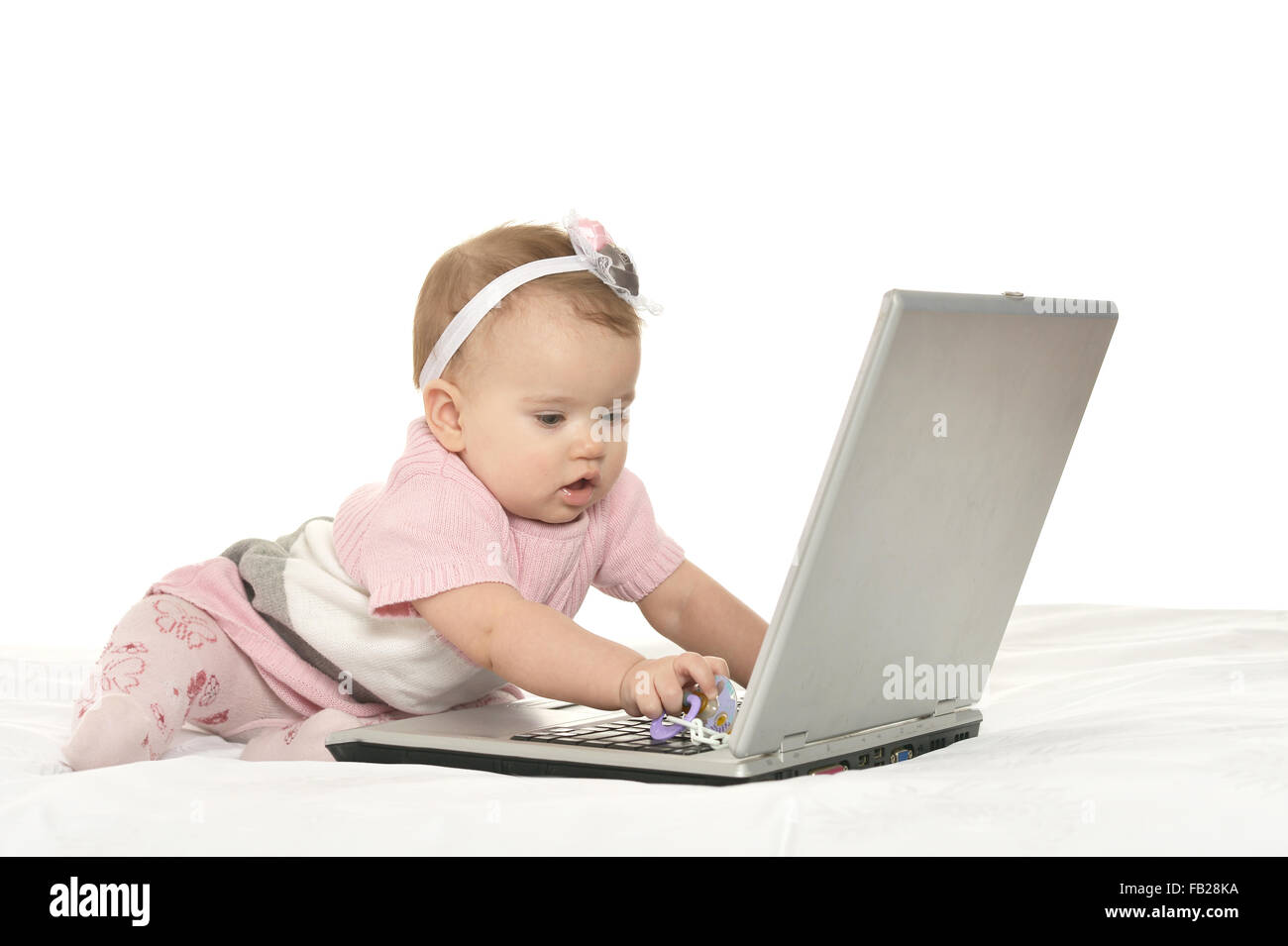baby playing with laptop Stock Photo - Alamy