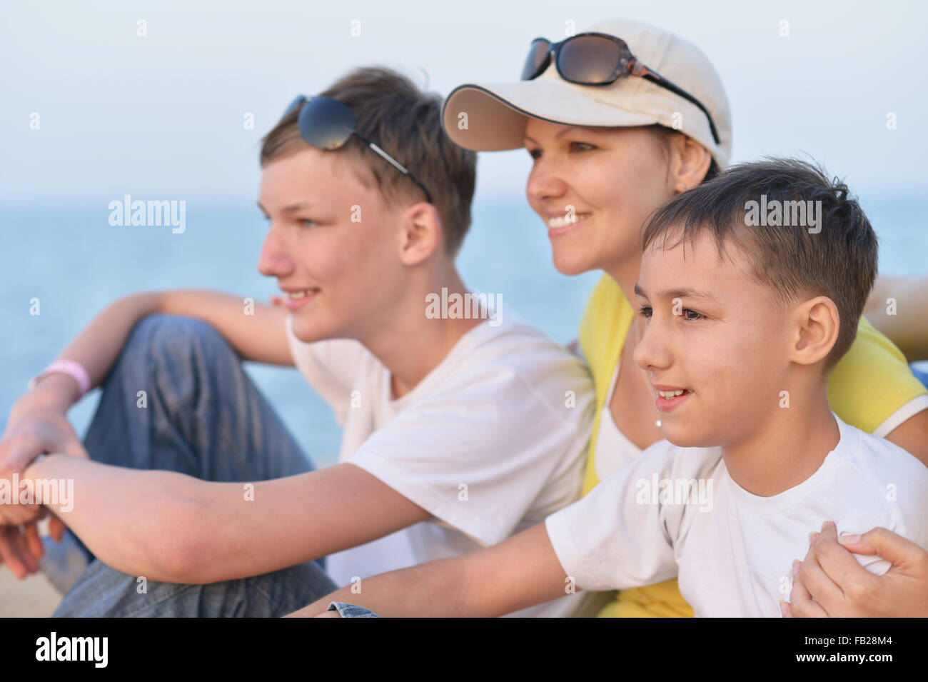 Mother and boys Stock Photo - Alamy