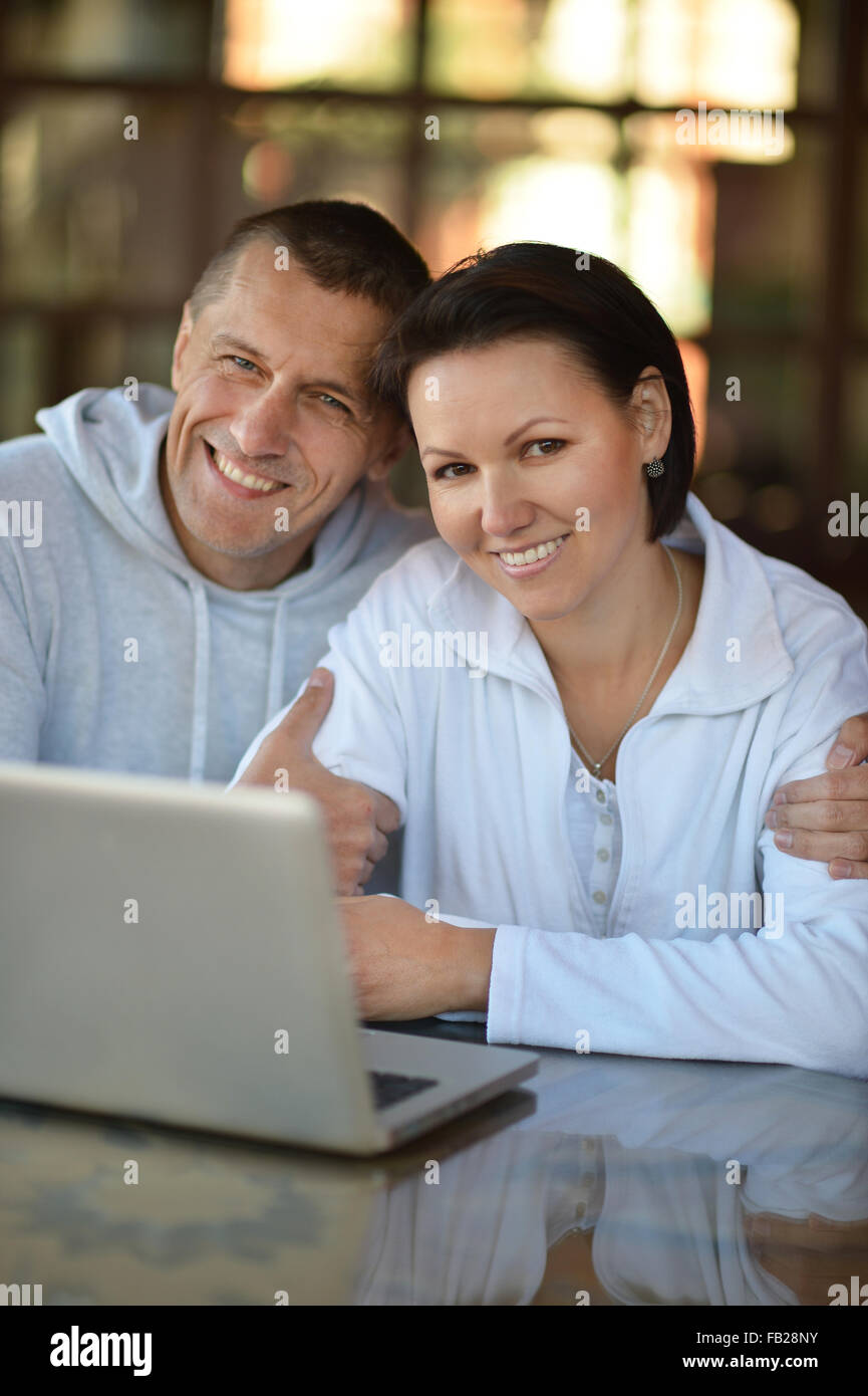 couple with laptop Stock Photo - Alamy