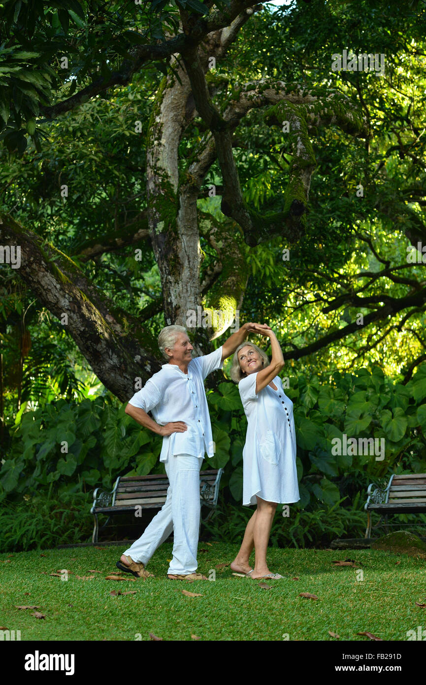 Happy middle-aged couple dancing outdoors Stock Photo - Alamy