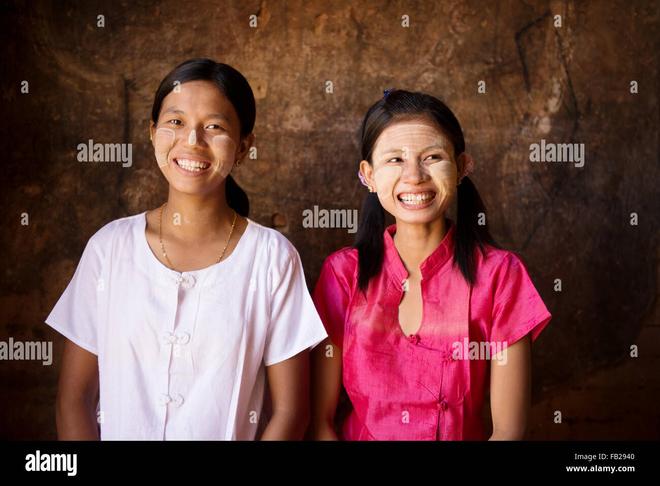 Portrait of beautiful young traditional Myanmar girls smiling. Close up ...
