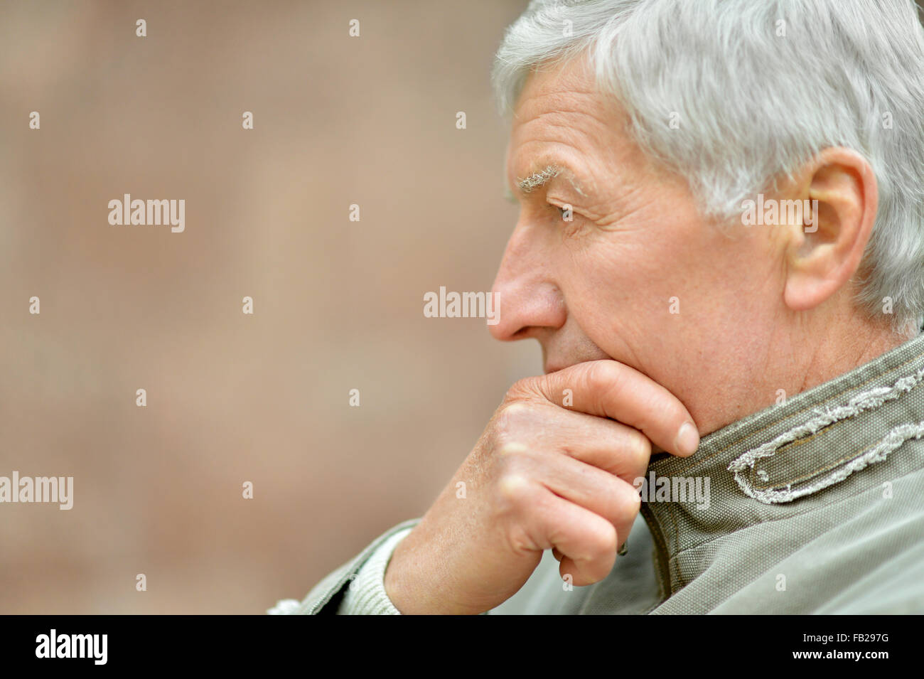 Portrait of senior man thinking Stock Photo - Alamy