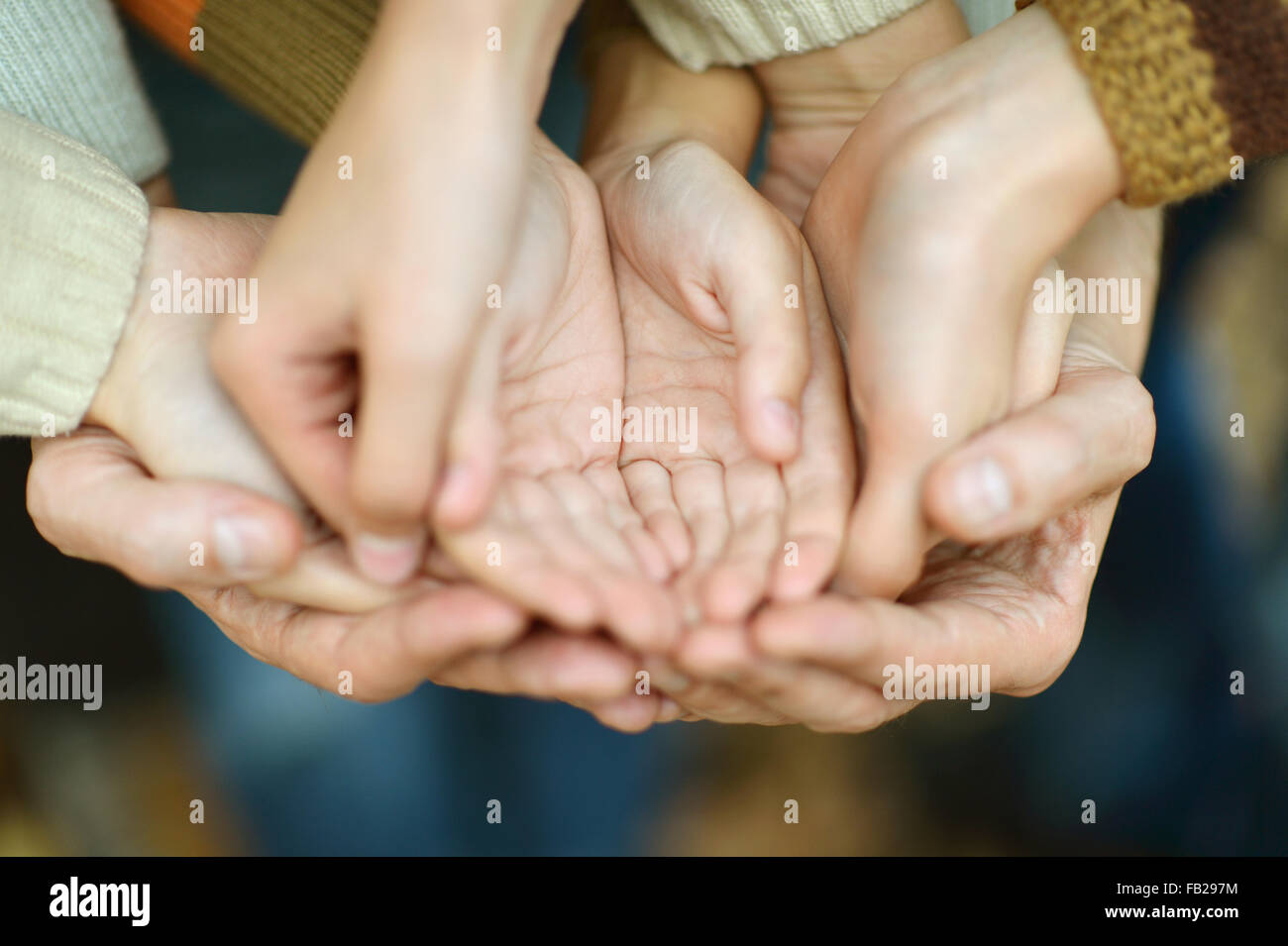 Hands held together Stock Photo - Alamy