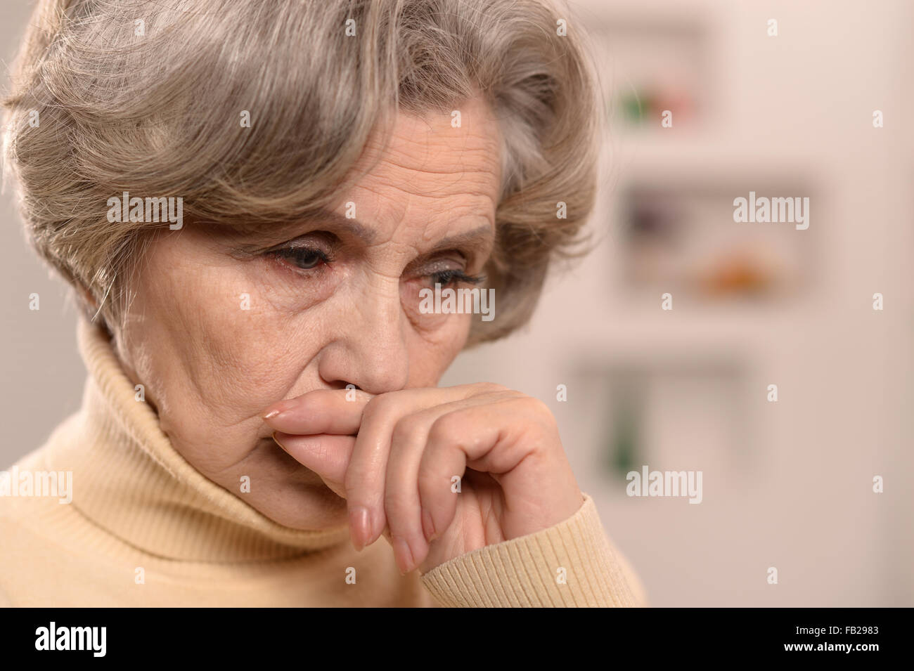 Sad aged woman Stock Photo - Alamy