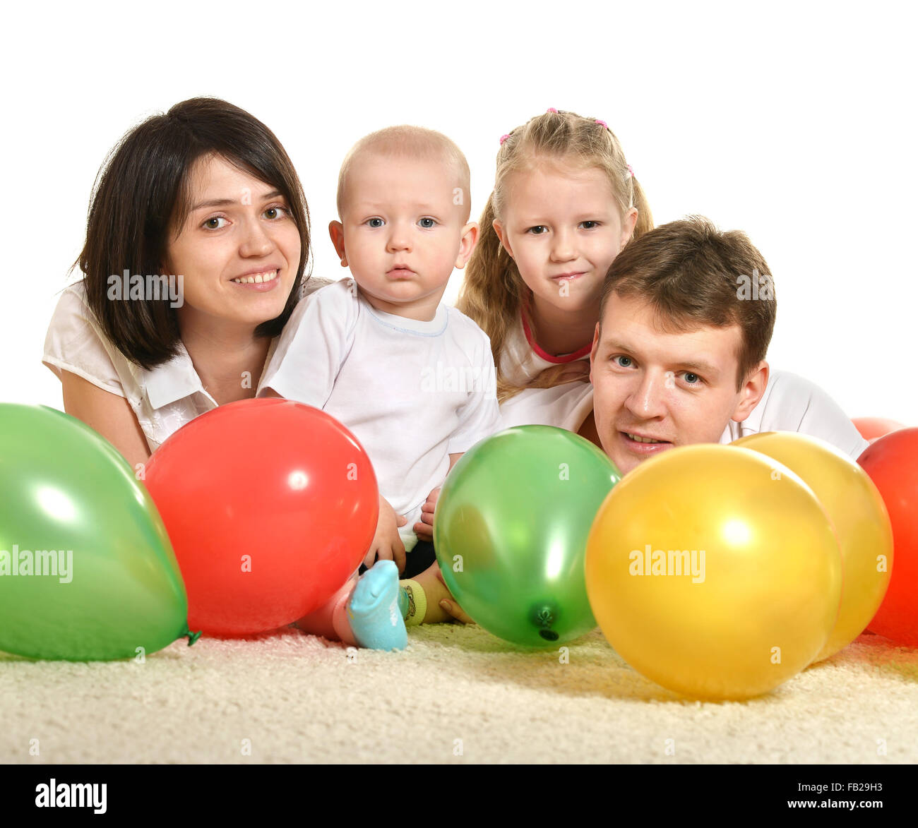 Family playing isolated on white Stock Photo - Alamy