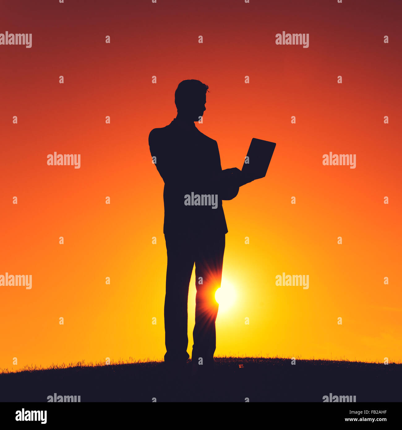 Business Man Standing Hill Using Laptop Concept Stock Photo - Alamy