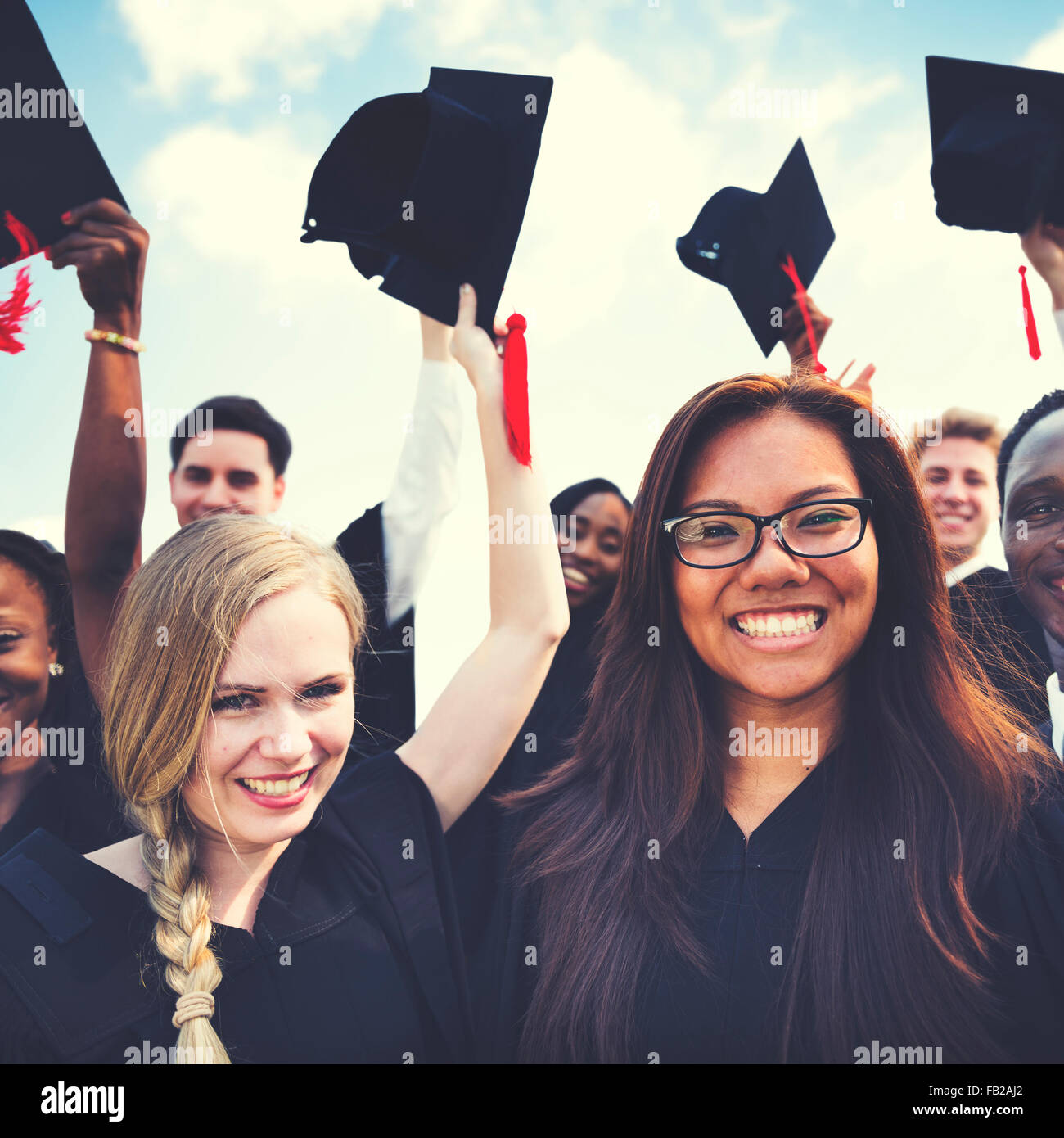 Group of Diverse Students Celebrating Graduation Concept Stock Photo ...