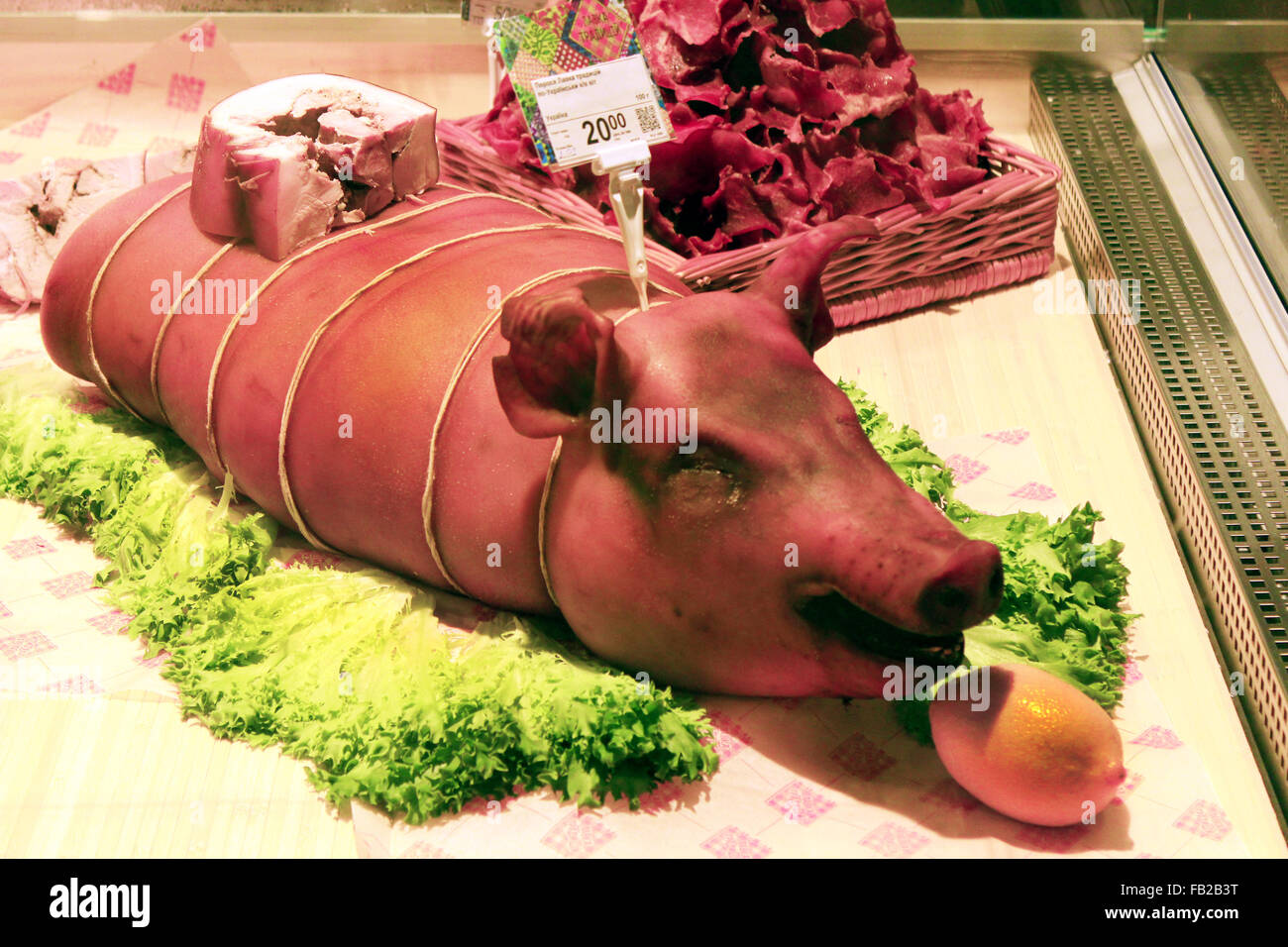 cooked and served pig sold in the grocery store Stock Photo - Alamy