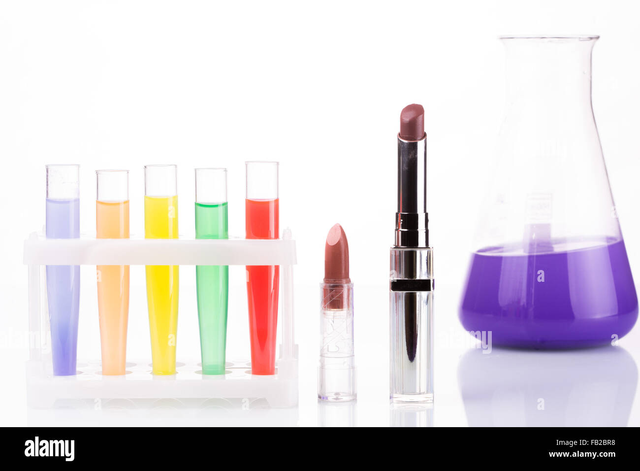 chemical test tubes and lipstick. harmful cosmetics Stock Photo - Alamy