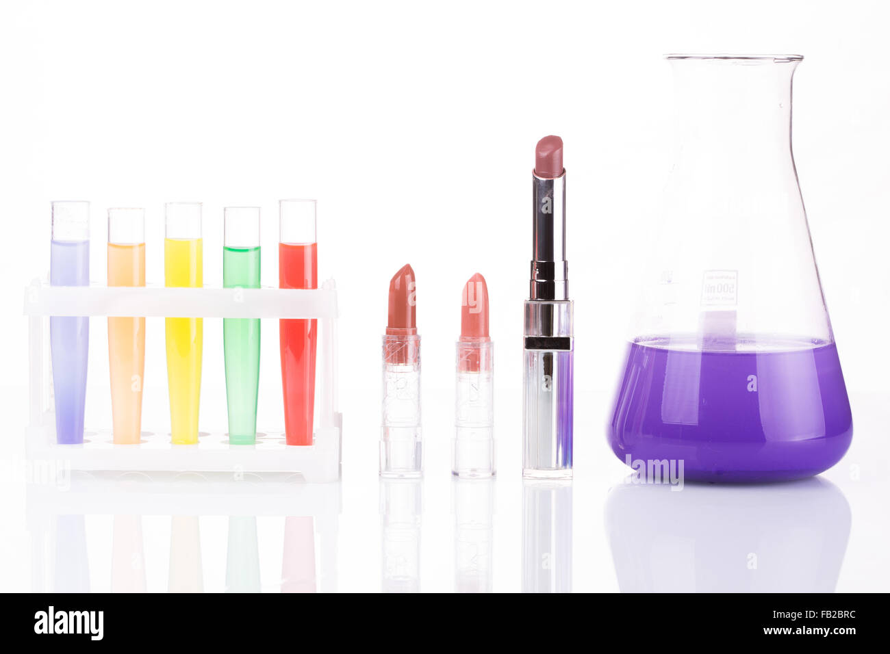 chemical test tubes and lipstick. harmful cosmetics Stock Photo - Alamy