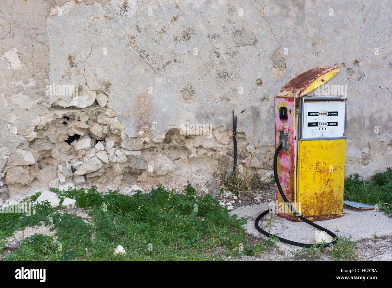 Distributor or gas pump, abandoned. Isolated, old and rusty in a war ...