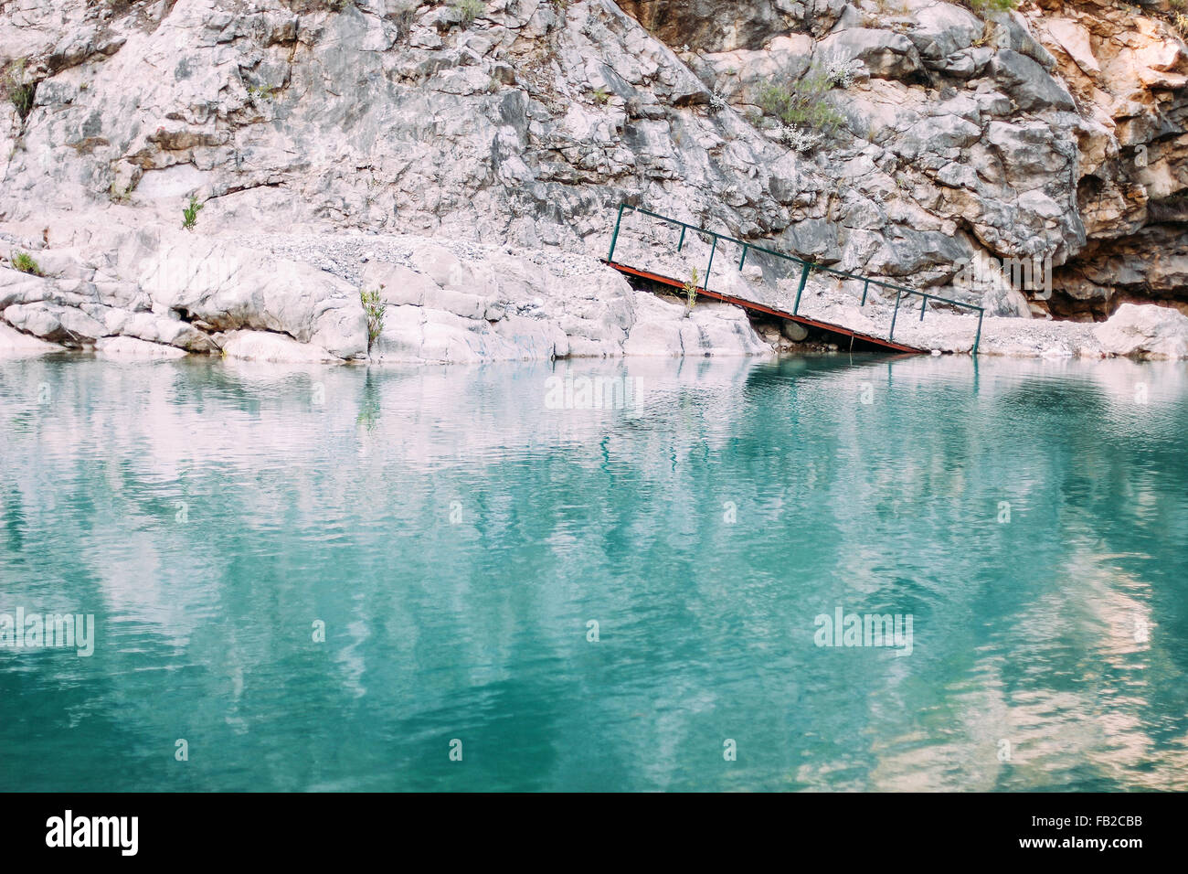 Bridge in the mountains with river Stock Photo - Alamy