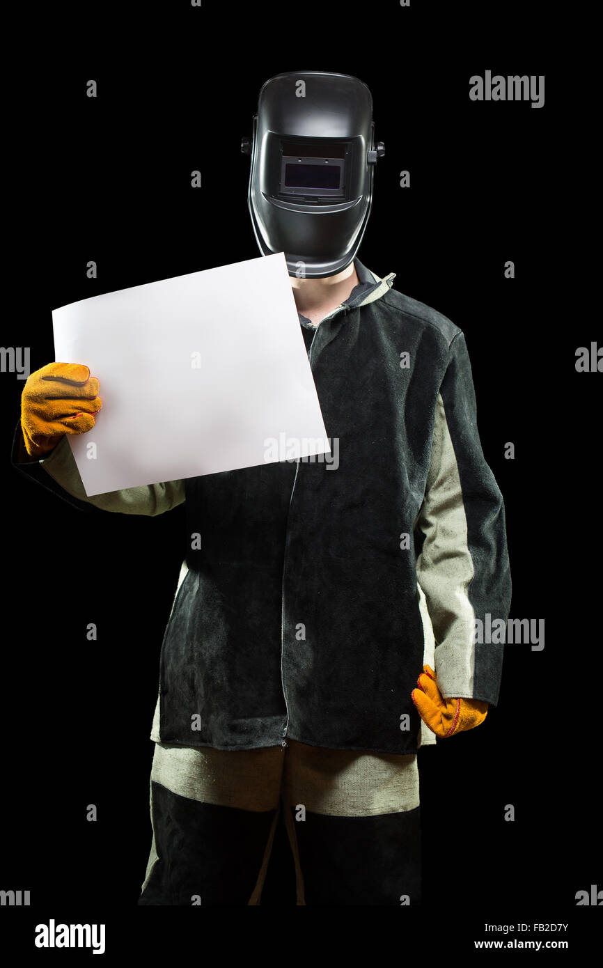 handsome welder holding a blank form. isolated on black background ...