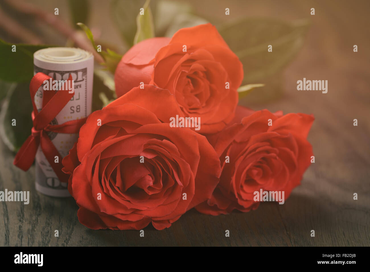 three red roses and bunch of dollars Stock Photo - Alamy