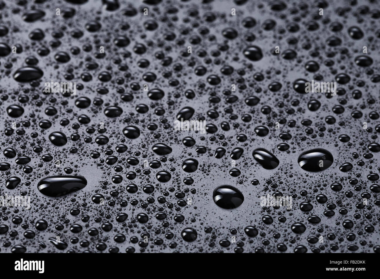 water drops on a black plastic surface Stock Photo - Alamy