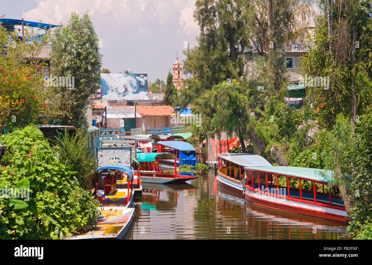 The colourful tourist boats on the canals of Xochimilco, Mexico City ...