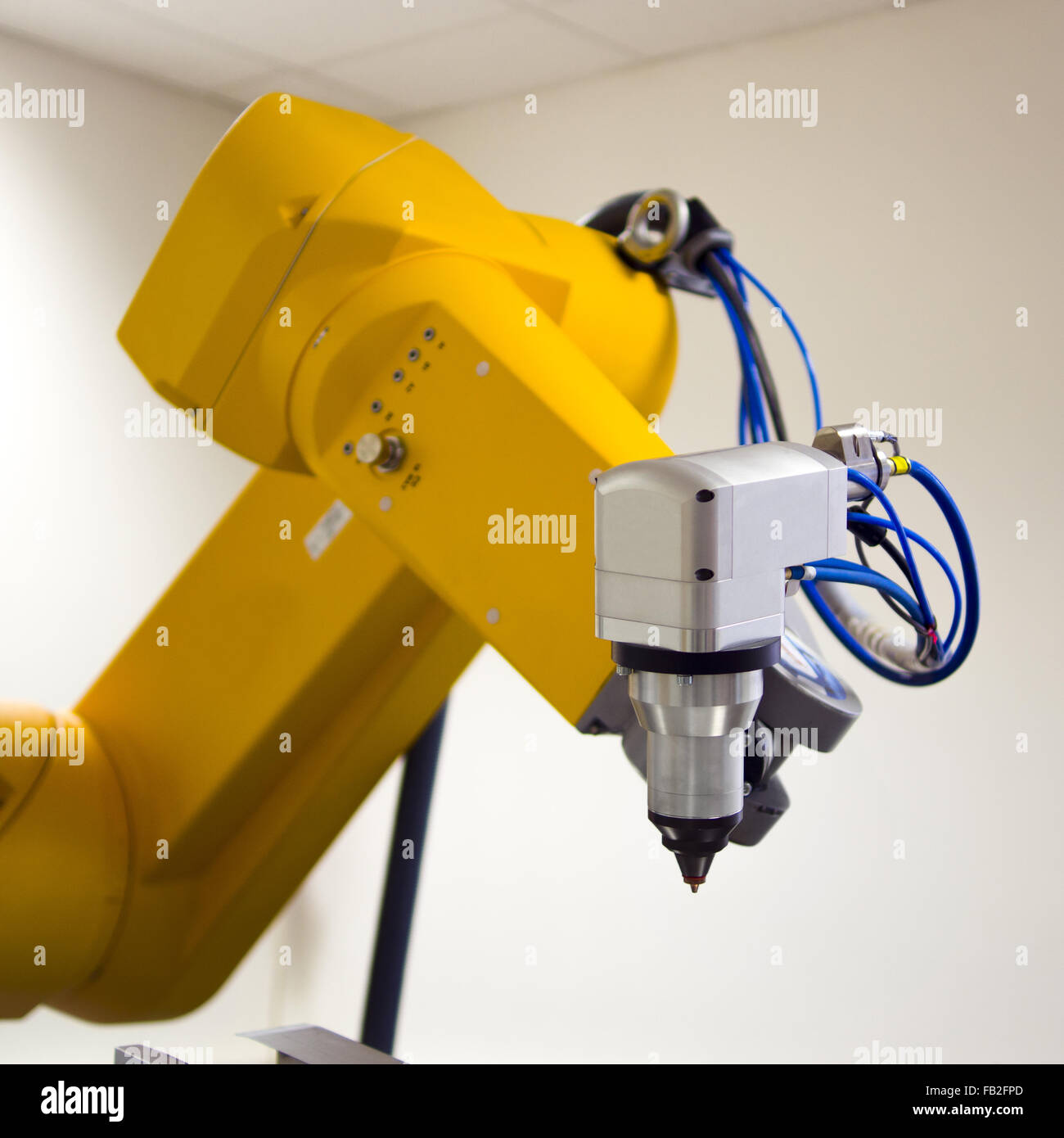 Robotic arm with laser head Stock Photo - Alamy