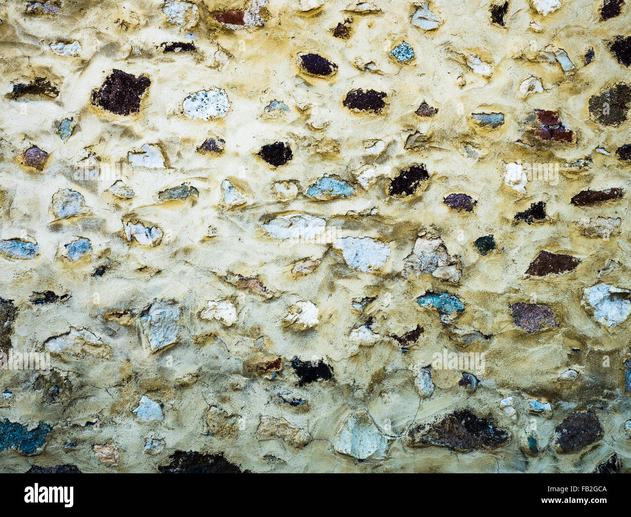 ancient colored wall made of stone and pieces of brick Stock Photo - Alamy